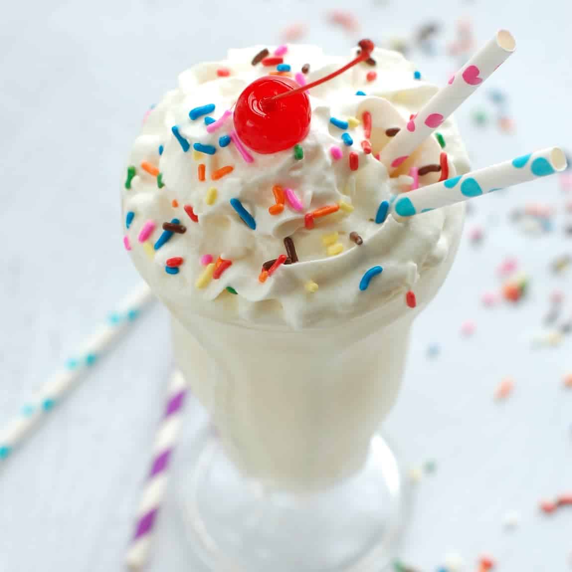Vanilla Milkshake With Whipped Cream And Sprinkles