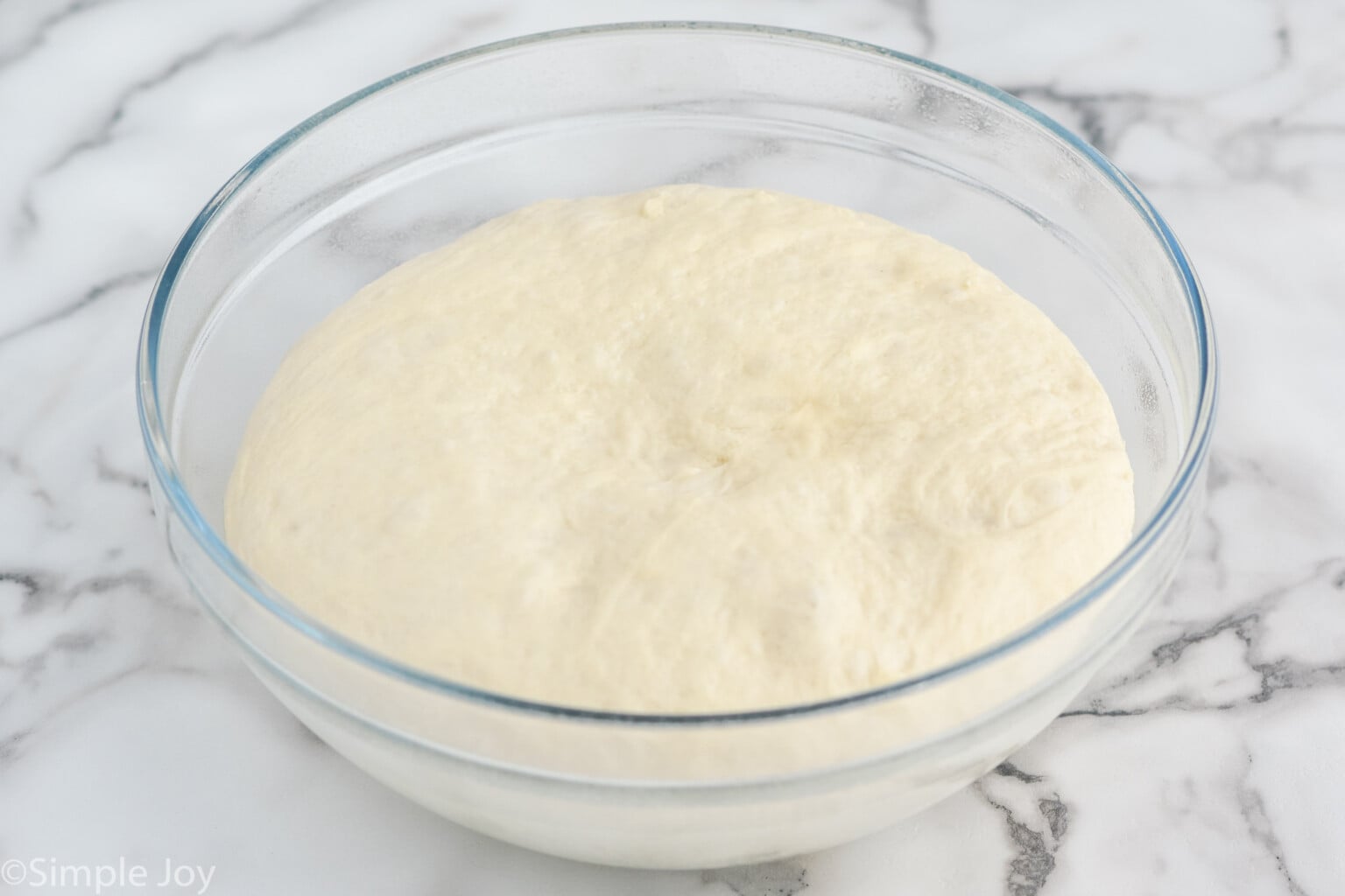 The Secret To The Perfect Pizza Dough Recipe - Simple Joy